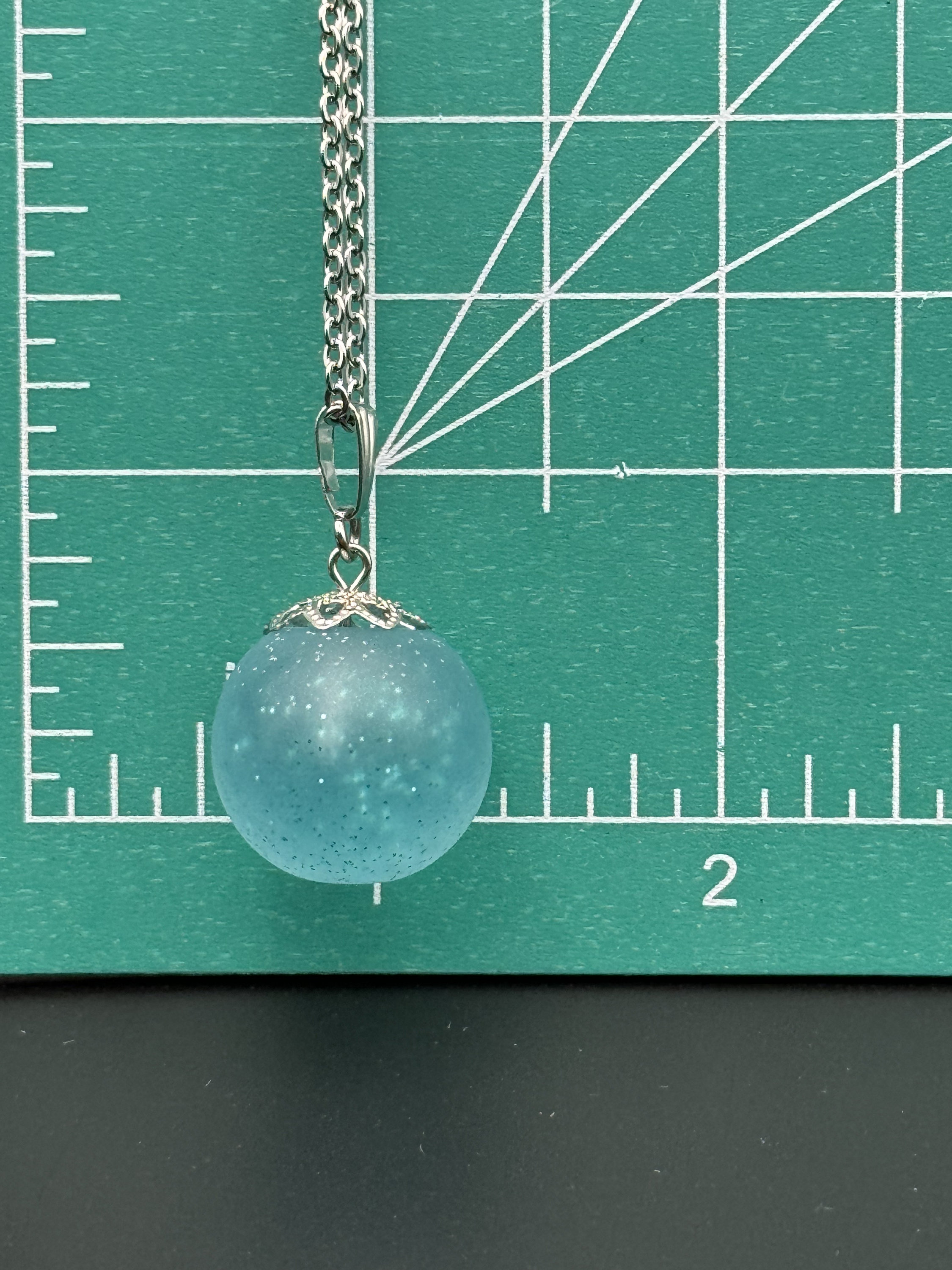 Blue Sphere Necklace Attached With A Silver Toned Flower Topper and a ...