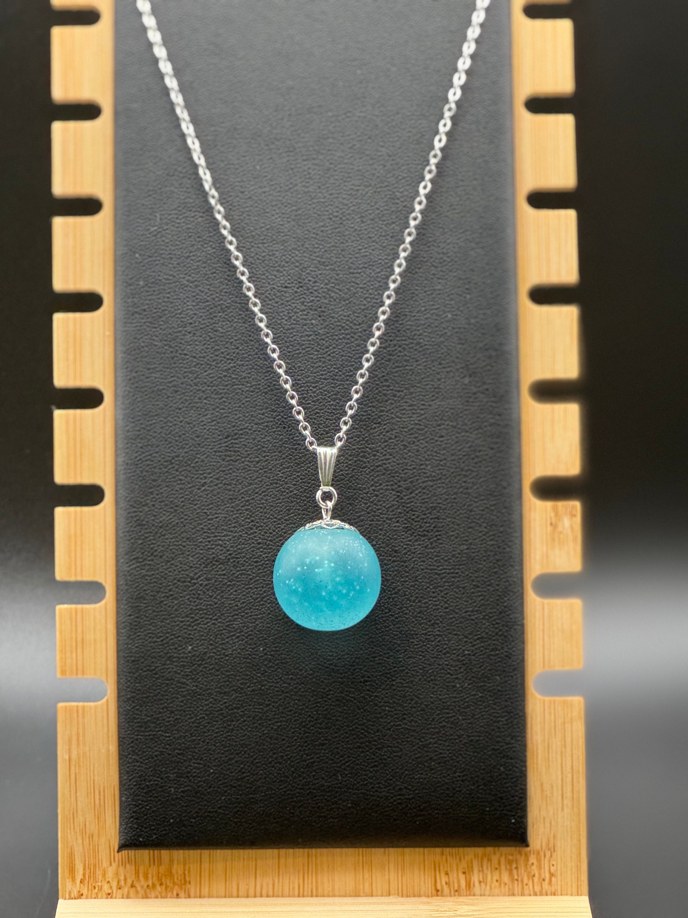 Blue Sphere Necklace Attached With A Silver Toned Flower Topper and a ...