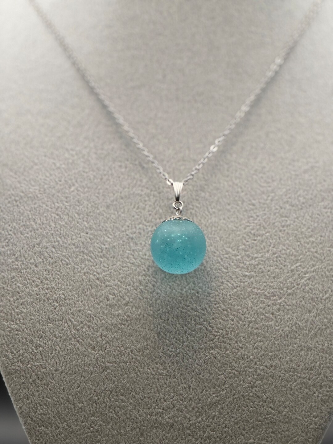 Blue Sphere Necklace Attached With A Silver Toned Flower Topper and a ...