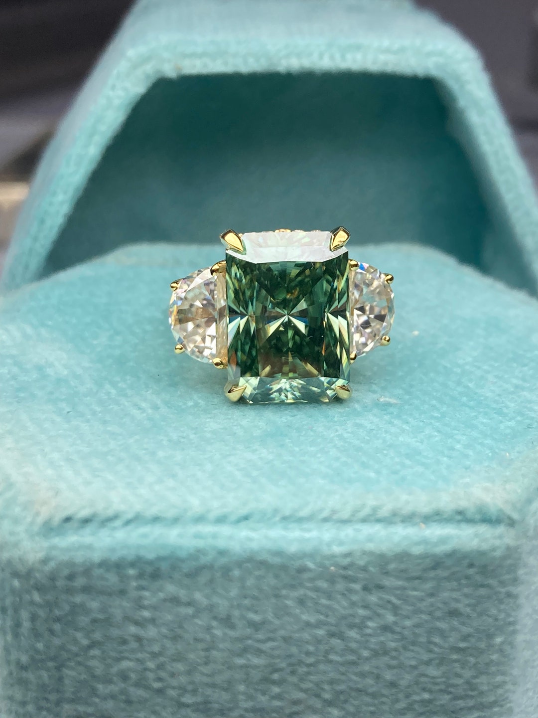 Green Radiant Hidden Halo Three Stone Ring, Half Moon Side Stones ...