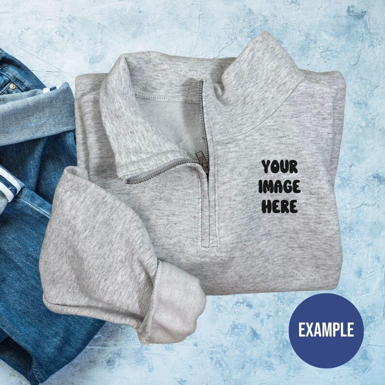 Folded Flat Lay With Jeans Mockup for Jerzees 995MR Quarter Zipper With ...