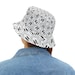 Melting Smiley Face Bucket Hat - EDM Rave Gear - Black and White Bucket ...