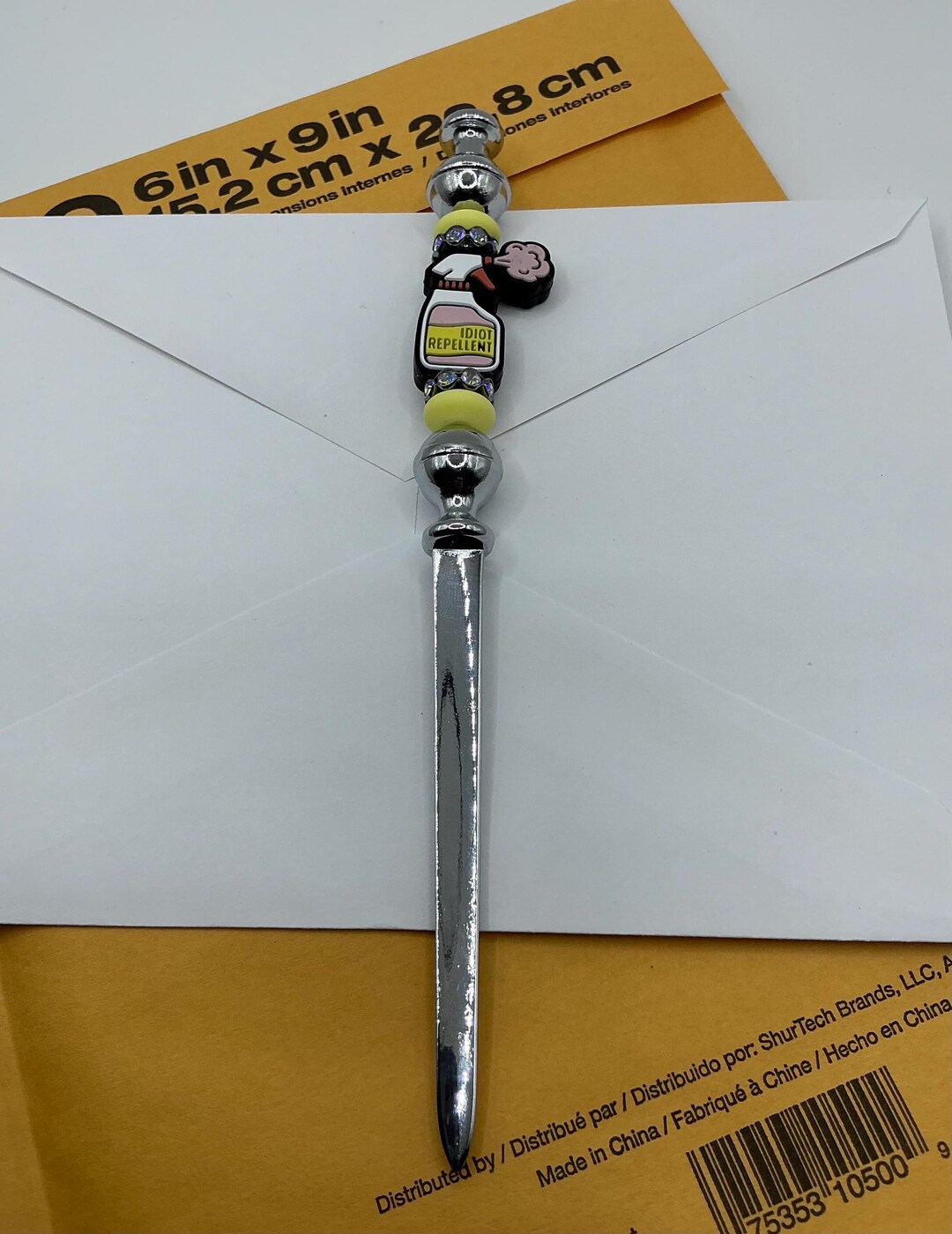 Spray “idiot Repellent” on a Silver Letter Opener. Yellow Disc Silicone ...