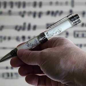 Musical Instruments Pen (piano, Drums, Guitar Represented) With an ...