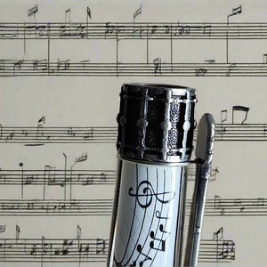 Musical Instruments Pen (piano, Drums, Guitar Represented) With an ...