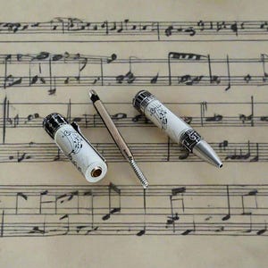 Musical Instruments Pen (piano, Drums, Guitar Represented) With an ...