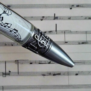 Musical Instruments Pen (piano, Drums, Guitar Represented) With an ...