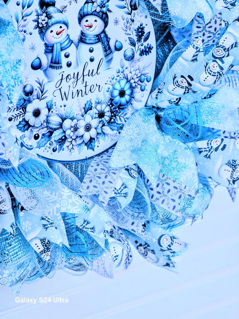 A Winter-themed Snowman Wreath on 14 Metal Frame With a Metal Sign That ...