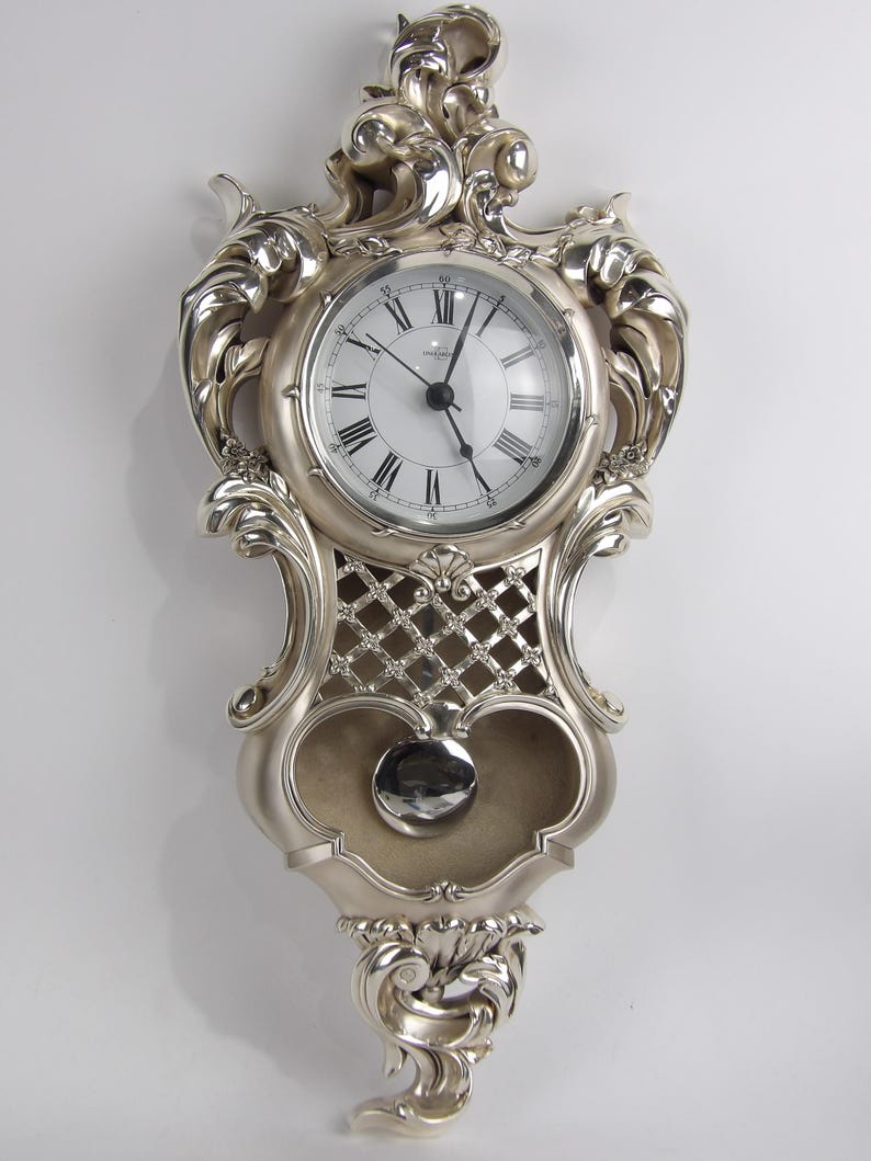 Elegant Pendulum Wall Clock in Silver Resin – Ornate Decorative Design ...
