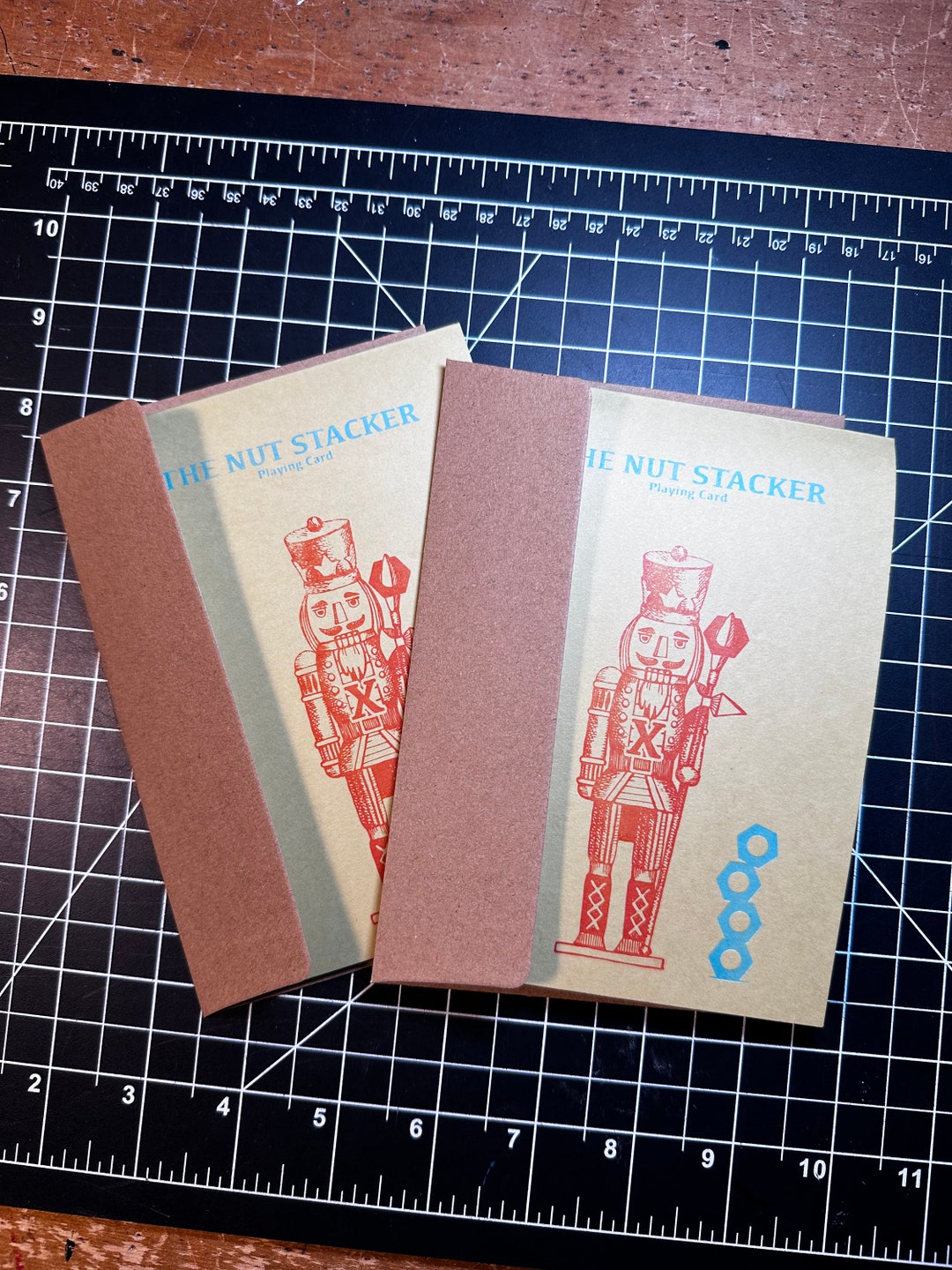 The Nut Stacker Playing Card With 3d Printed Copper Colored Nuts and ...