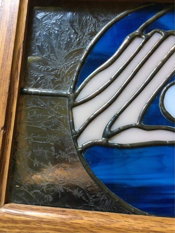 Stained glass hands box hand gesture posed in a trian… - Gem