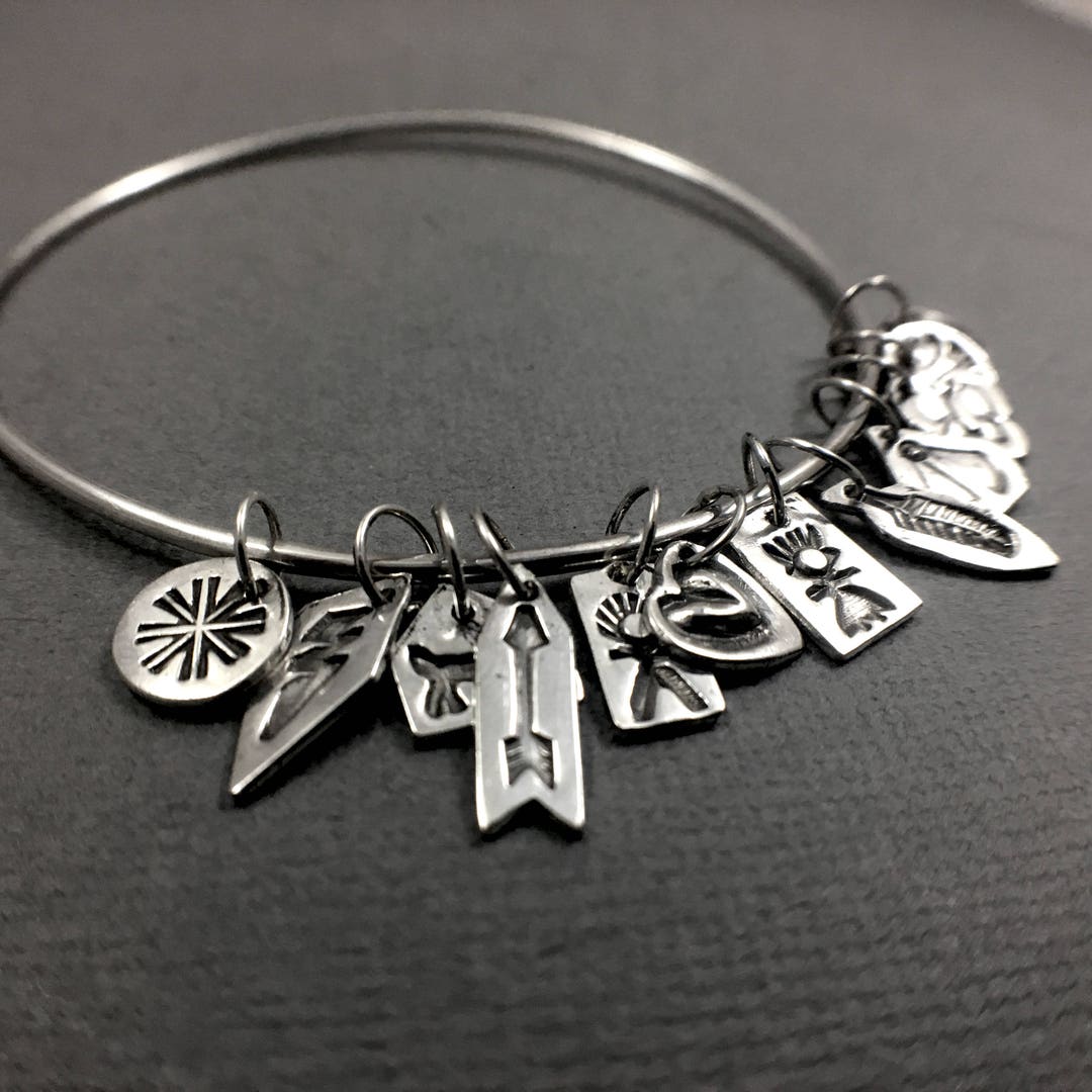 Tiny Charm Bangle - Sterling Silver Bangle With a Dozen Tiny Stamped ...