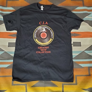 CIA Greatest Hits Collection Volume One T-shirt - Etsy