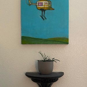 Yellow and White Camper Creature Hovers Over the Flint Hills ORIGINAL ...