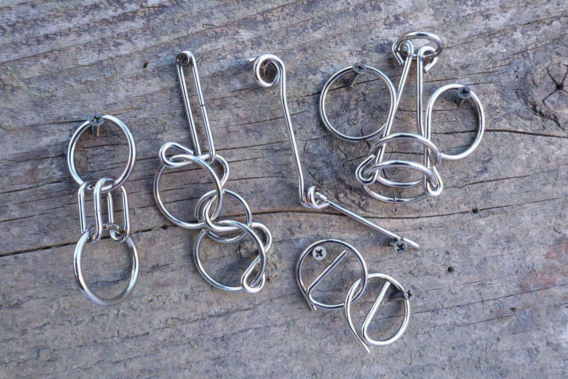Hanayama Wire Puzzle Set - Orange Contains 5 Mini Wire Puzzles. IQ ...