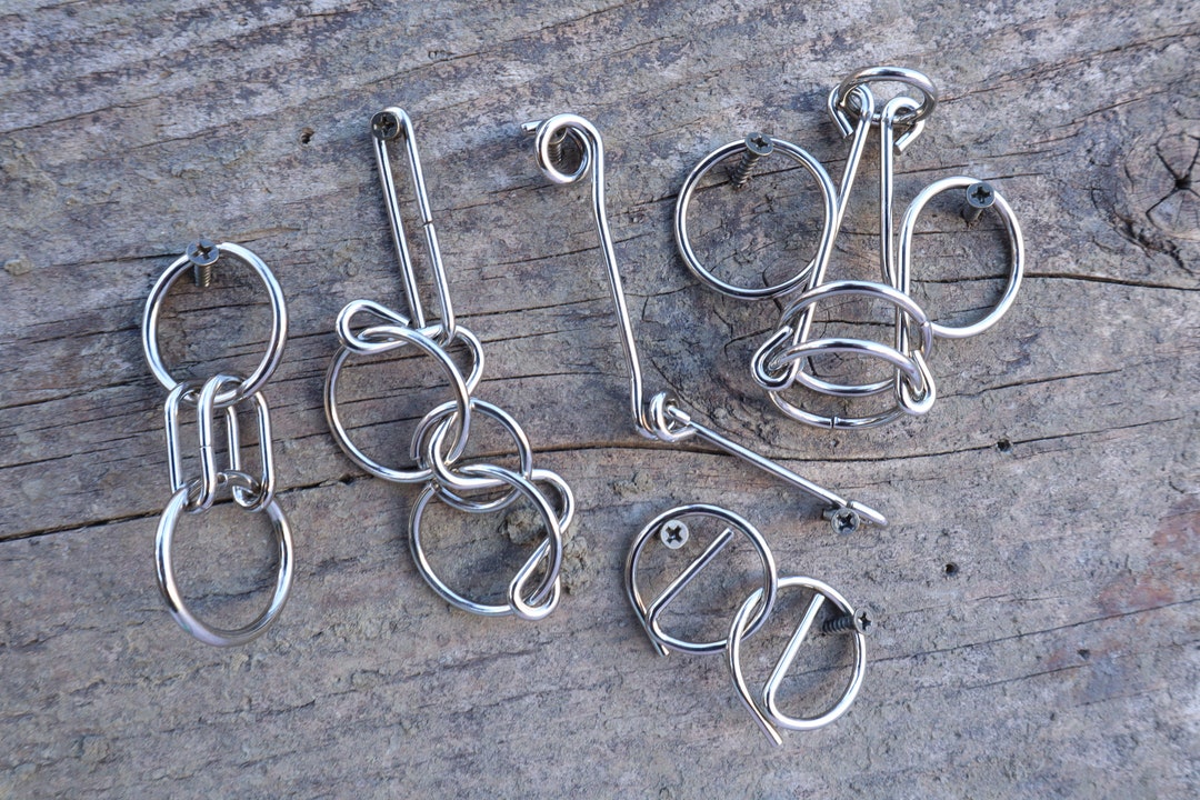 Hanayama Wire Puzzle Set - Orange Contains 5 Mini Wire Puzzles. IQ ...