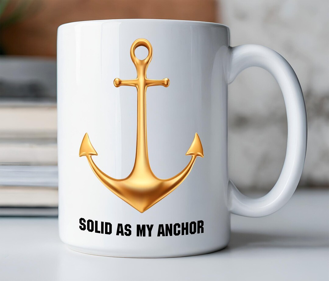 This 15oz Ceramic Mug Features a Gold Anchor With the Phrase "solid as ...