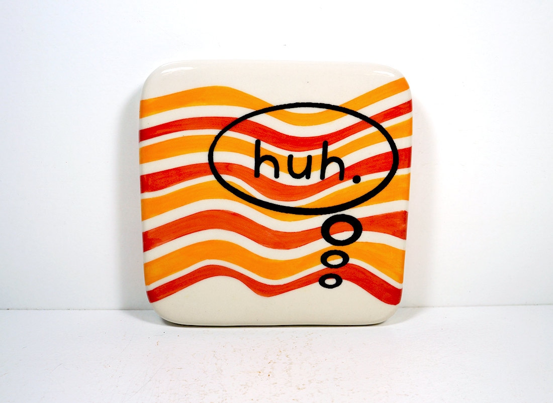 tile with huh. thought bubble on orange and red-orange waves. Ready to ...
