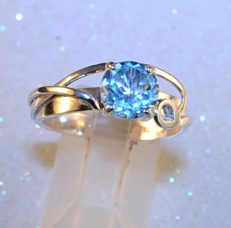 Floating Blue Topaz gemstone ring | Etsy
