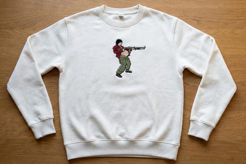 Willa Ferderson Shooting Machine Gun Embroidery Sweater, Perfidia ...