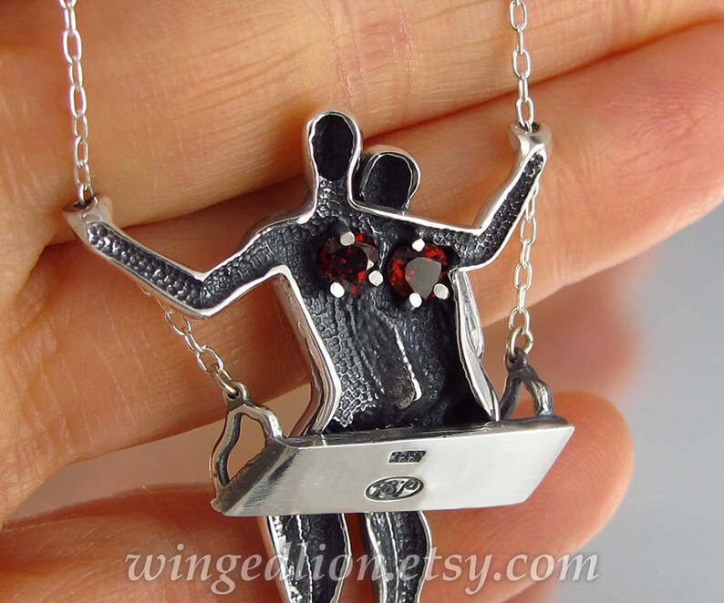 TWO HEARTS Silver Pendant on a Swing With Garnets - Etsy