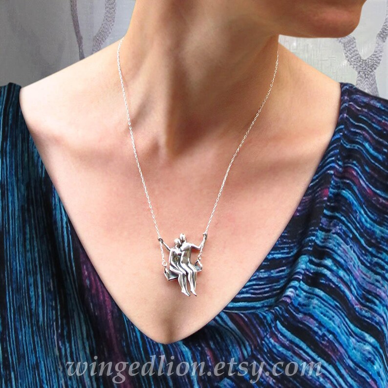 TWO HEARTS Silver Pendant on a Swing With Garnets - Etsy