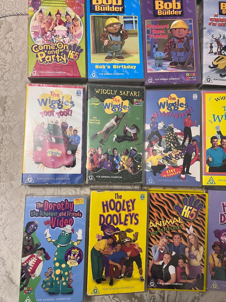 A Collection of Classic VHS Tapes Featuring Beloved Children's Shows ...