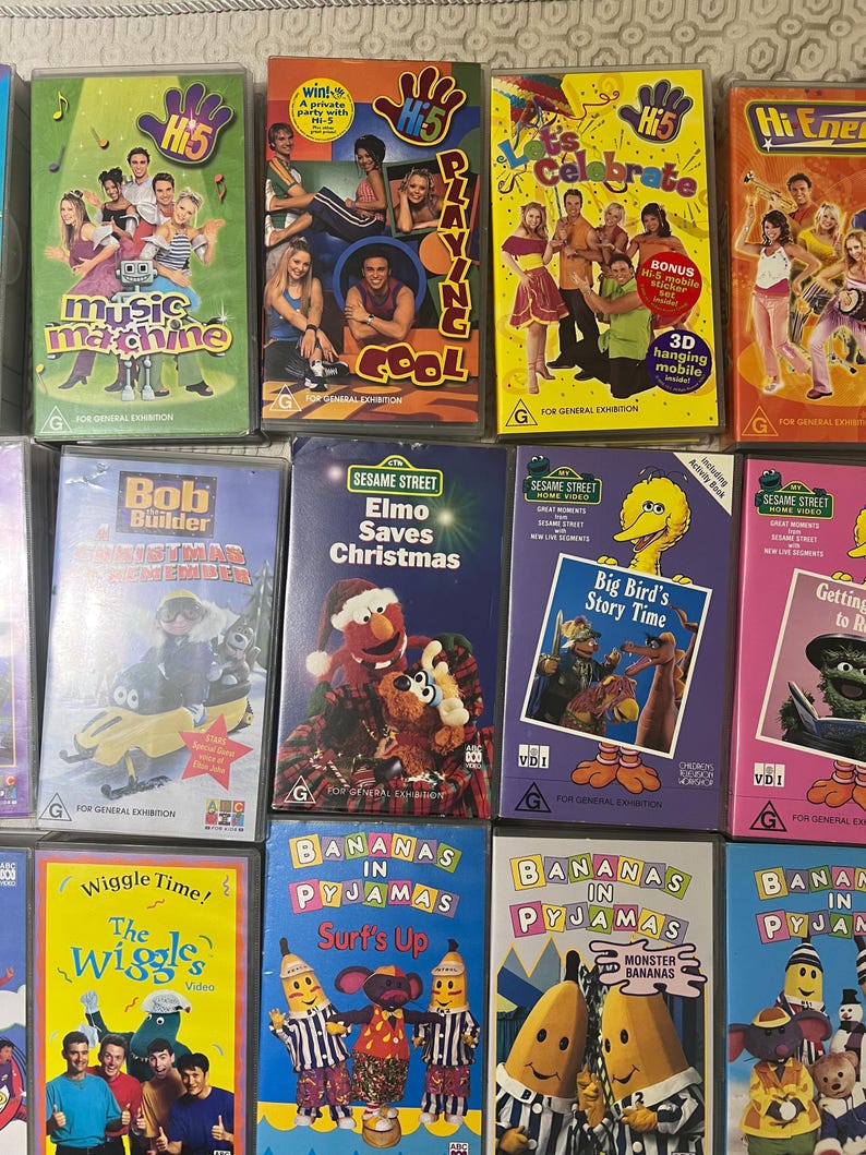 A Collection of Classic VHS Tapes Featuring Beloved Children's Shows ...