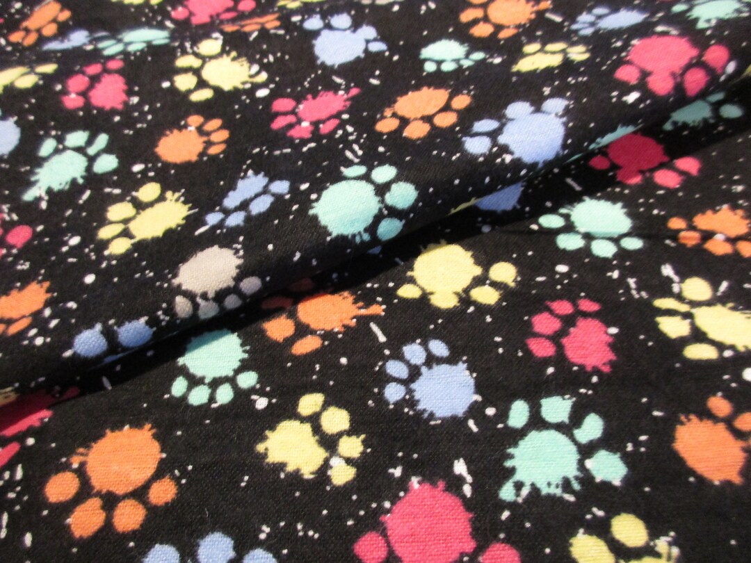 Paw Print Paint Splatter on Black Super Snuggle Cotton Flannel Fabric ...