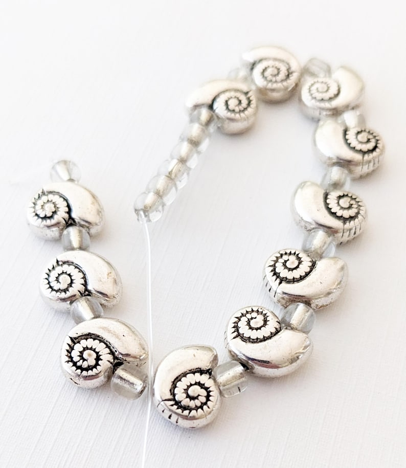 11 Silver Shell Shaped Beads With Clear Dividing Beads 8mm X 10mm ...