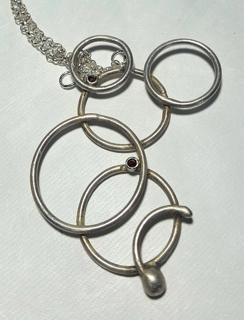 Circus Rings sterling silver pendant | Etsy