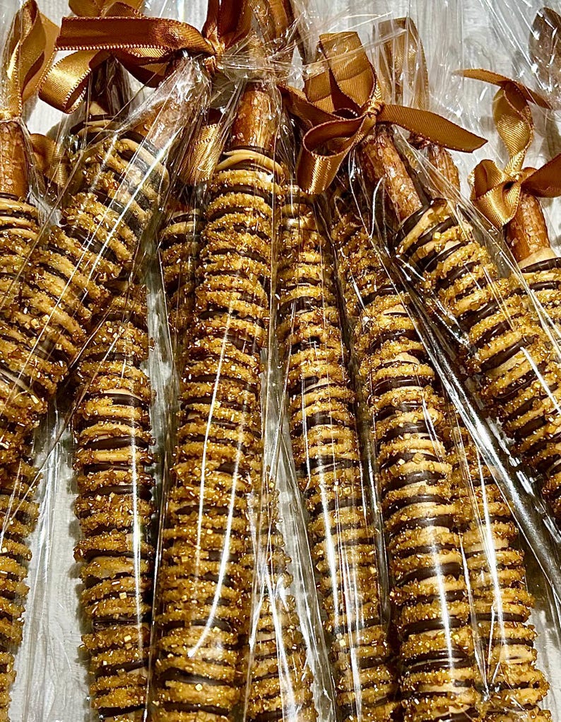 Caramel Coated Pretzel Rods With Chocolate Drizzle & Golden Sugar ...