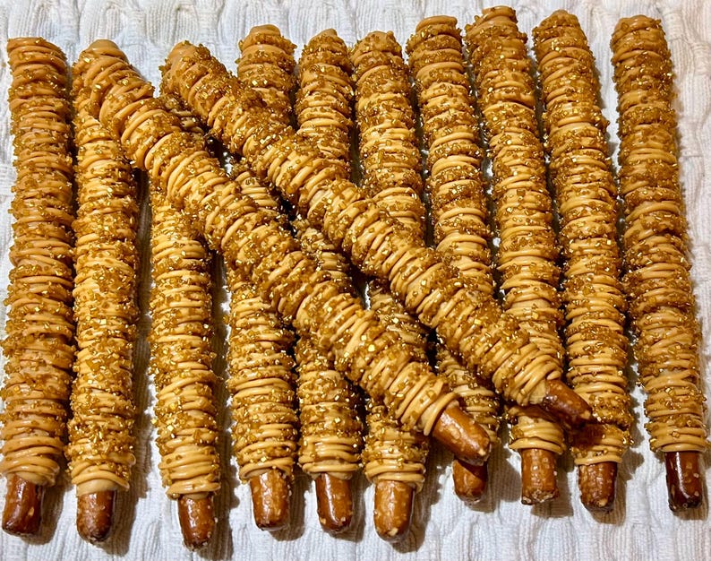 Pretzel Rods Coated in Carmel Flavored White Chocolate With Golden ...