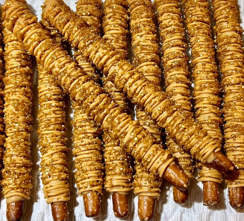 Pretzel Rods Coated in Carmel Flavored White Chocolate With Golden ...