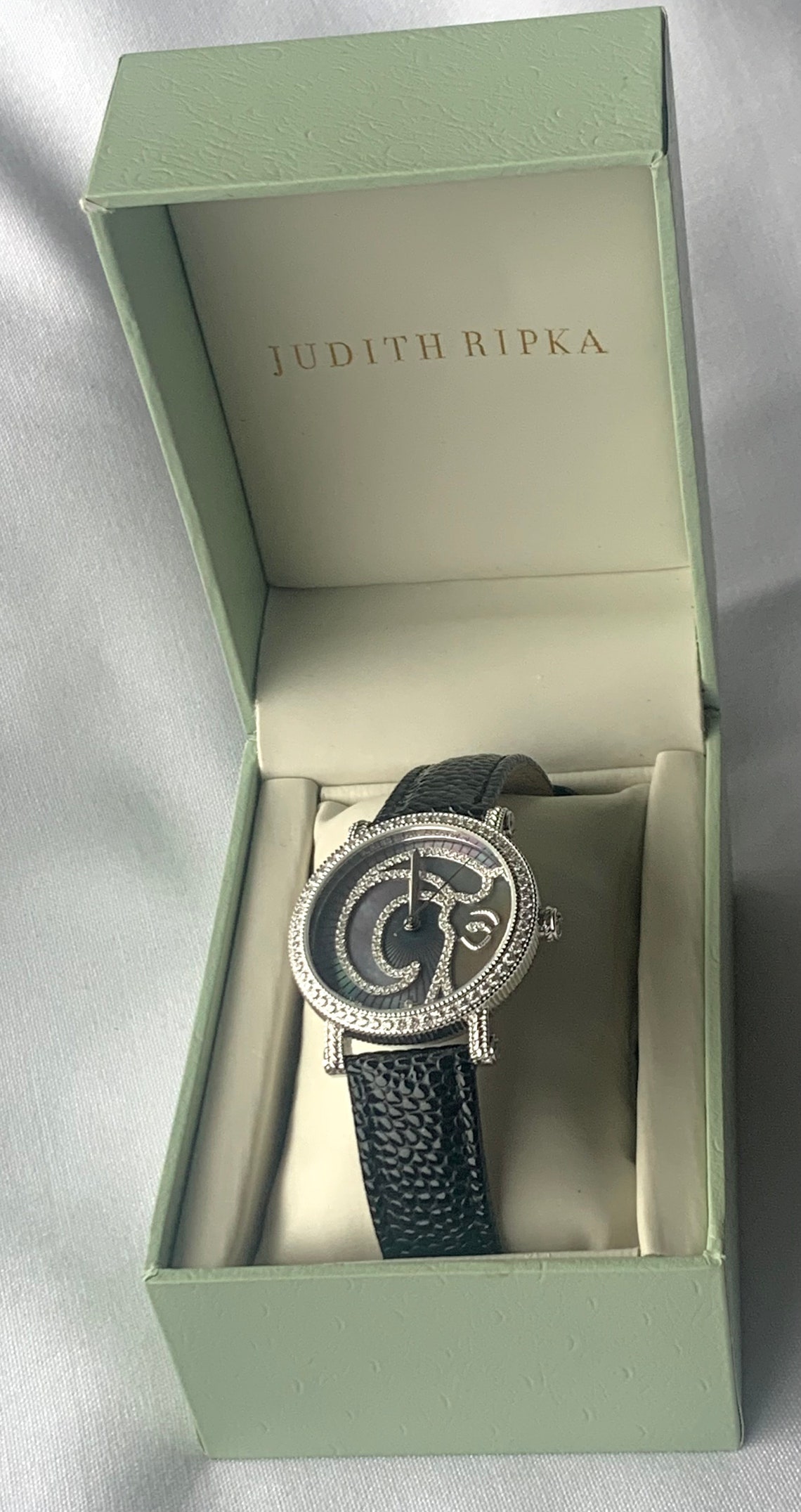 Judith Ripka Aries Zodiac Watch. Mother of Pearl Face. Black Leather ...