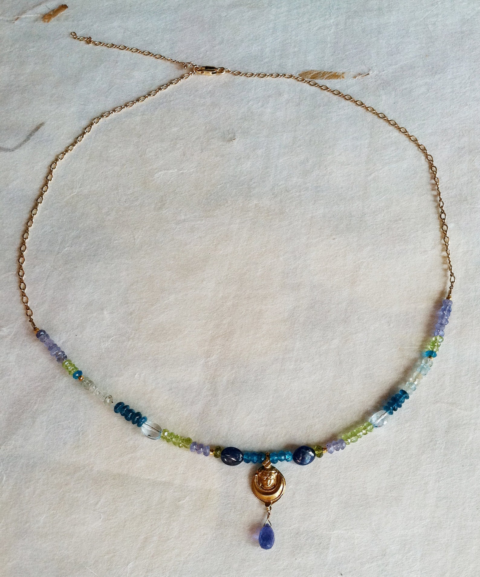 22k Antique Indian Charm Hangs Between a Sparkling Rainbow of Gems and ...