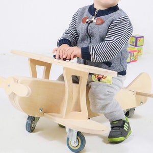 Wooden ride on airplane store
