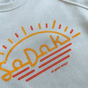 Sodak Neon Sun Crew Sweatshirt by Oh Geez! Design - South Dakota ...