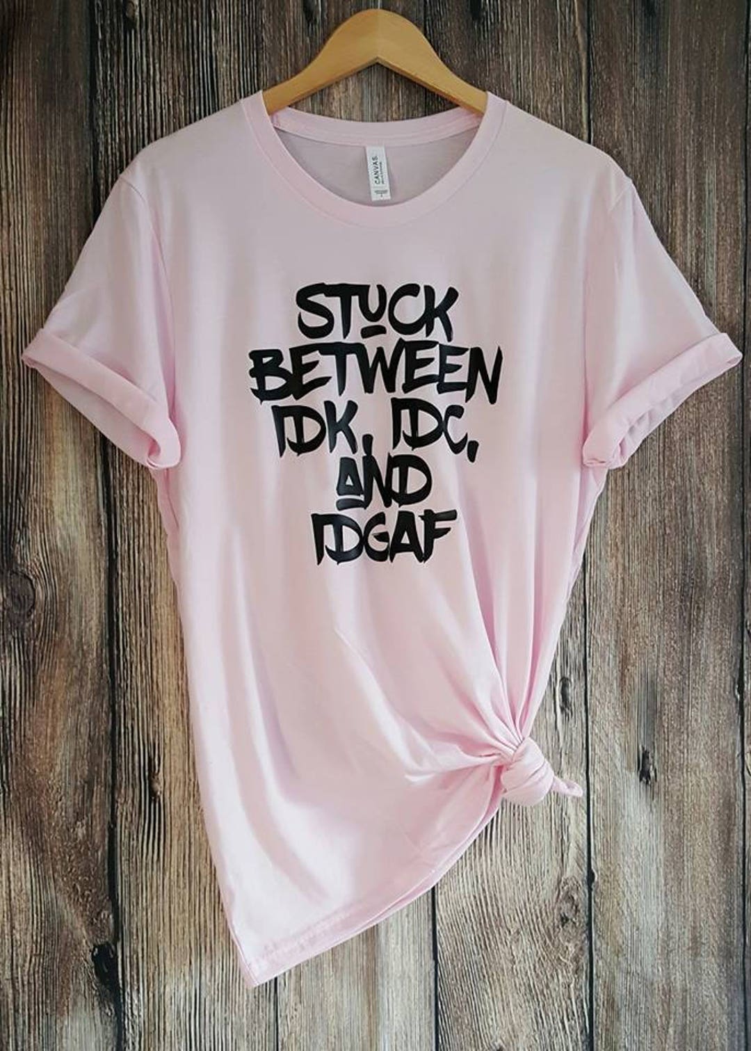 Stuck Between IDK, IDC, and IDGAF Shirt Graphic Tee Black and White ...