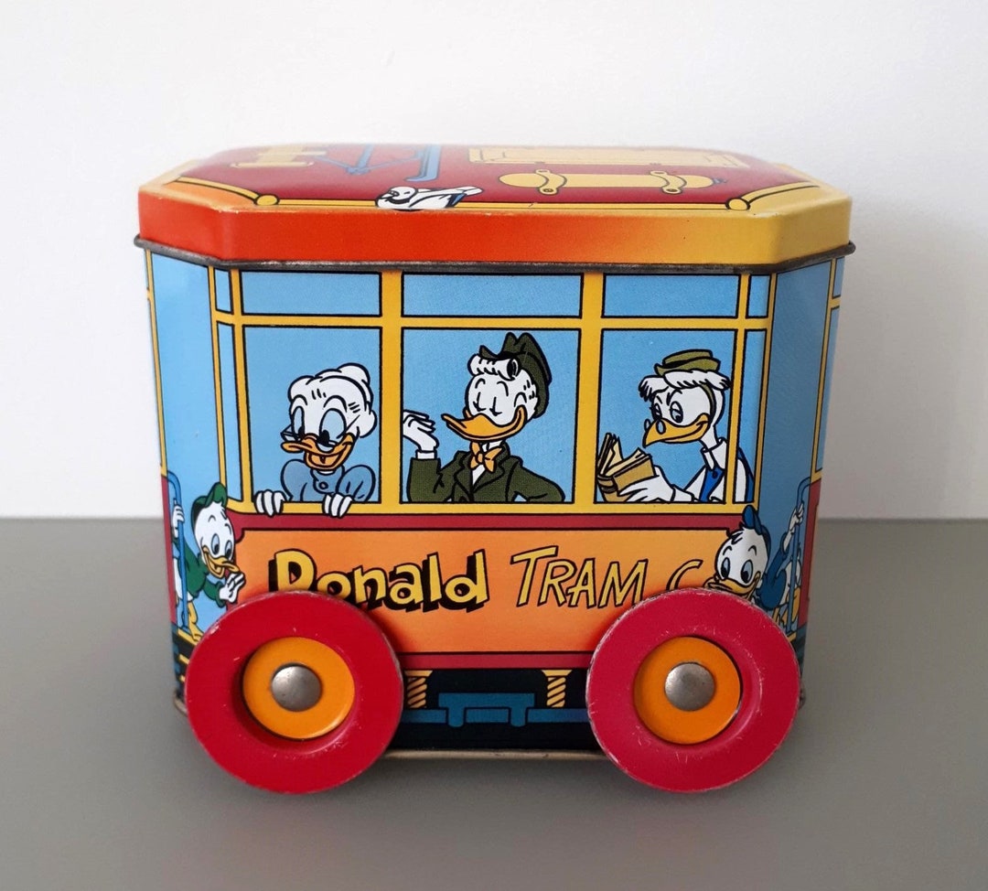 DONALD TRAM CO. Tin With Wheels Donald Duck Wheeled Tin Disney Donald ...