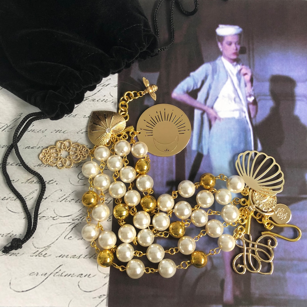 Rear Window Lisa Fremont Grace Kelly Bracelet in Pearl and Gold Charms ...