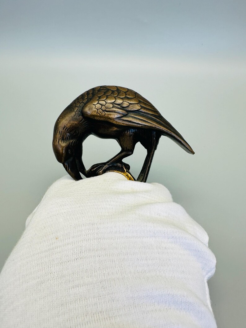 A Rare and Precious Bronze Raven in a Curled Position Standing on a ...
