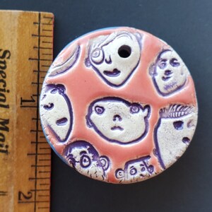 Reversible Ceramic Pink Moon Face Pendant With Purple Faces on the ...