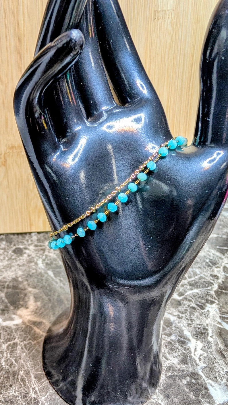 This Gold-tone Multi-strand Beaded Bracelet Features Turquoise Gemstone ...