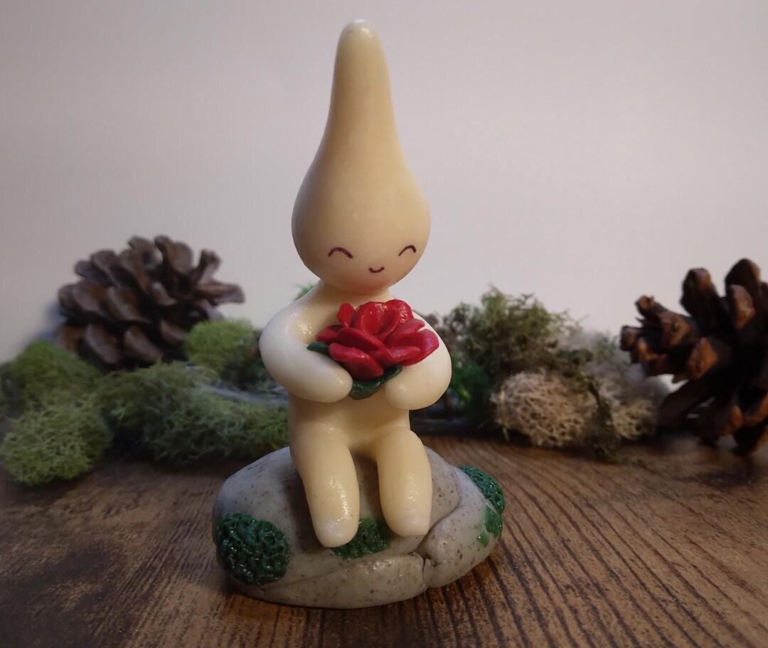 Wood Sprites Forest Figure With Flower Atop a Mossy Rock Glow in the ...