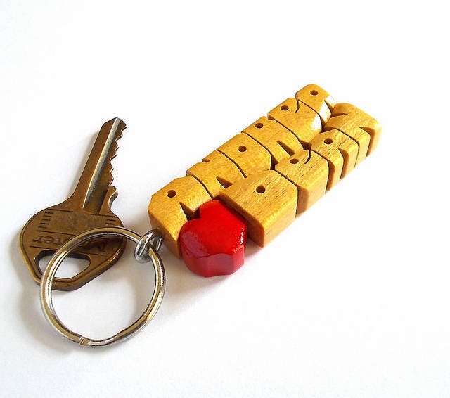 Wave Keychain in Pau Amarello Wood Custom Names Carved to | Etsy