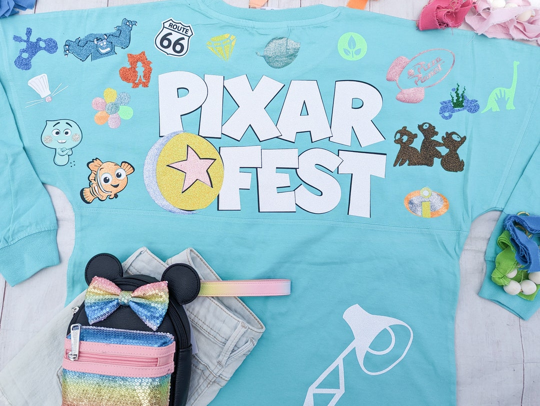 Pixar Fest Disneyland Sparkle Jersey Woman's Vinyl Pom Pom Jersey Shirt ...