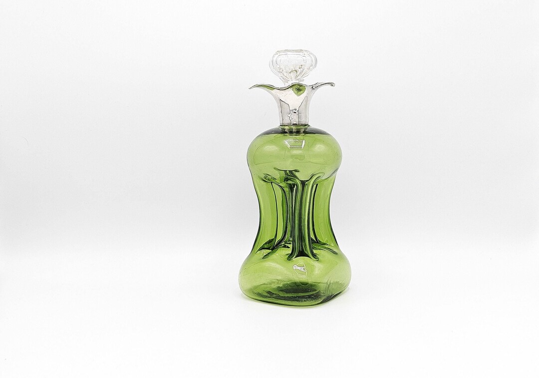 A Silver Mounted Glug-glug Glass Decanter, by William Comyns, London ...