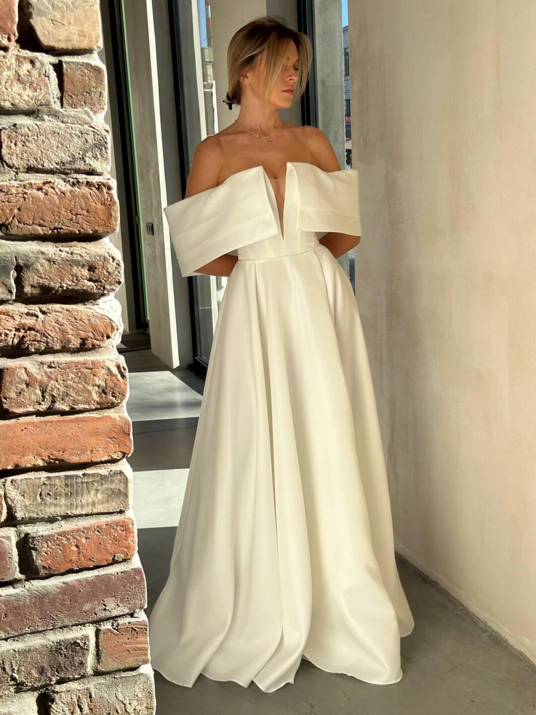 Architectural Wedding Dress With Draped Collar, Voluminous Skirt, Deep ...