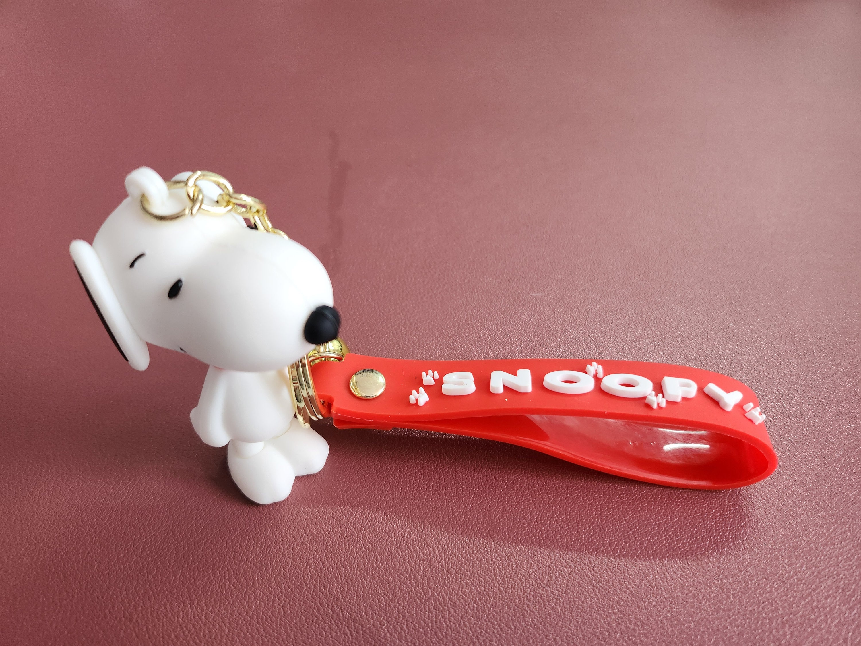 Charming Snoopy Keychain – White Snoopy Figure With Red Hand Strap and ...